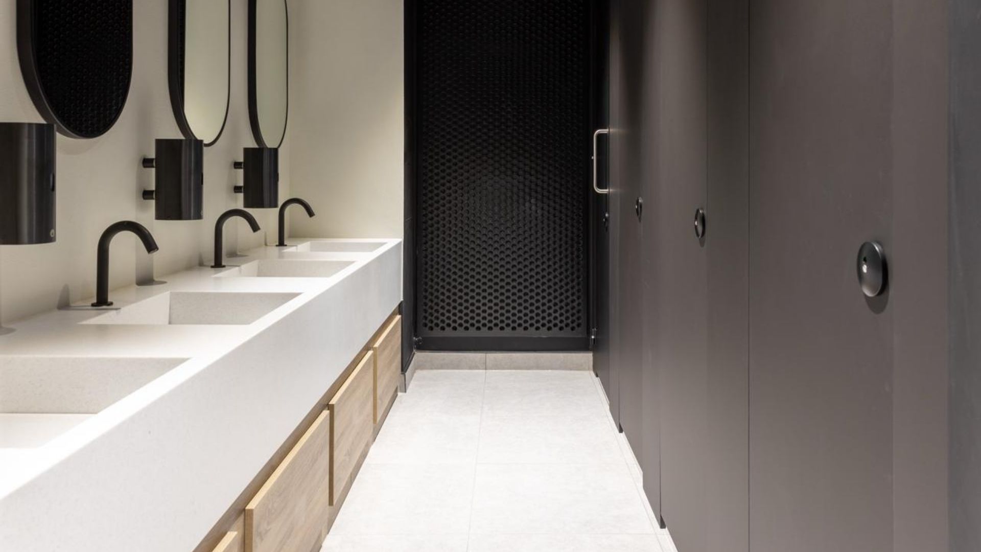Flush-fronted washroom design for a landmark sustainable workspace ...